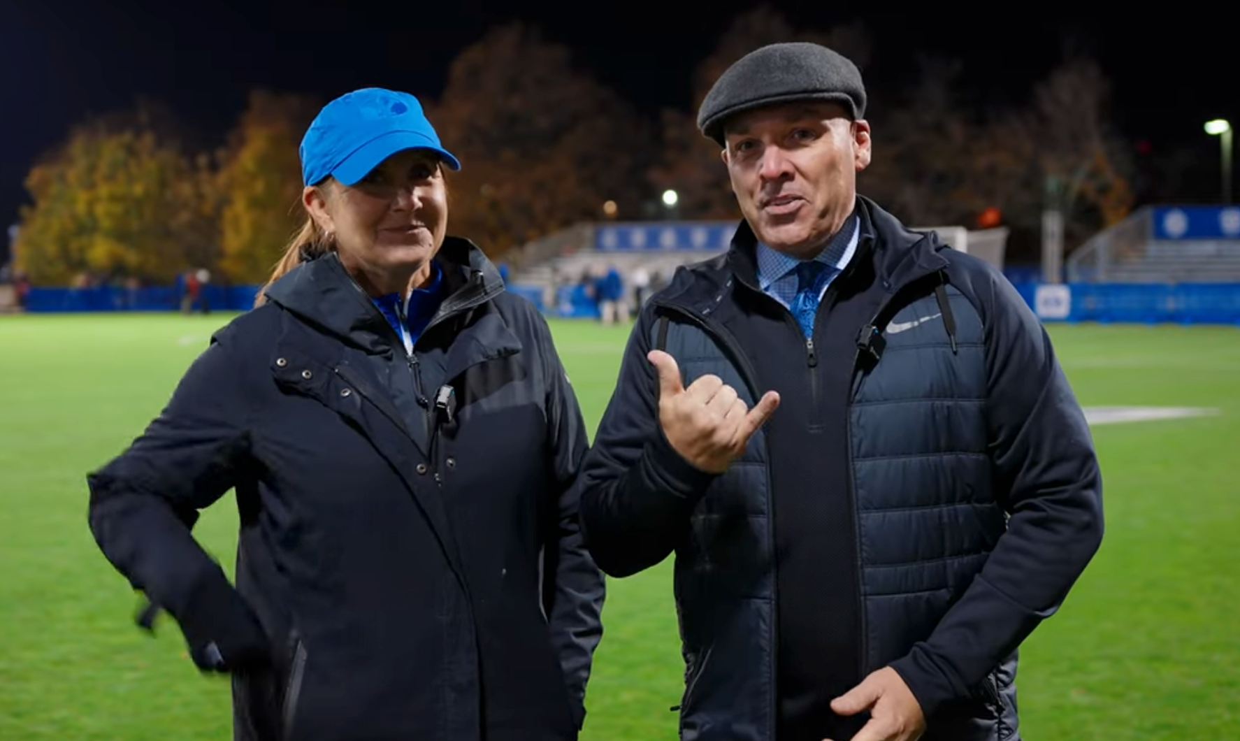 Head coach Jennifer Rockwood visits pitch-side with Greg Wrubell after ...